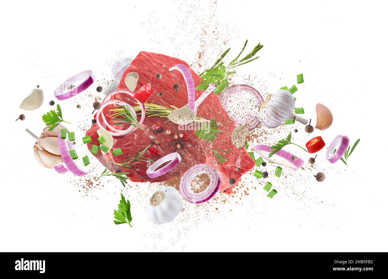 Fresh raw meat and different spices flying on white background Stock ...