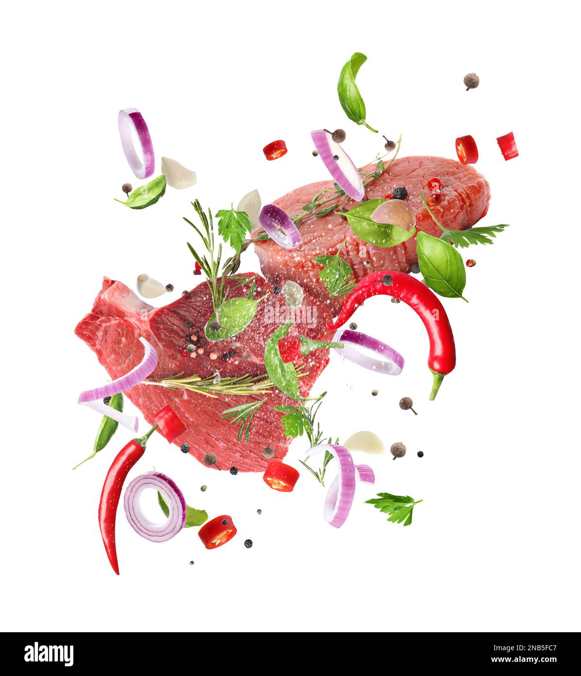 Fresh raw meat and different spices flying on white background Stock ...