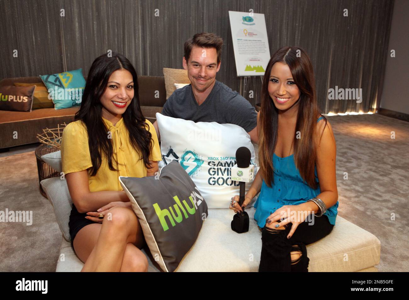 Ginger Gonzaga, left, Brian Kimmet, and Xbox host Michelle Marie are ...