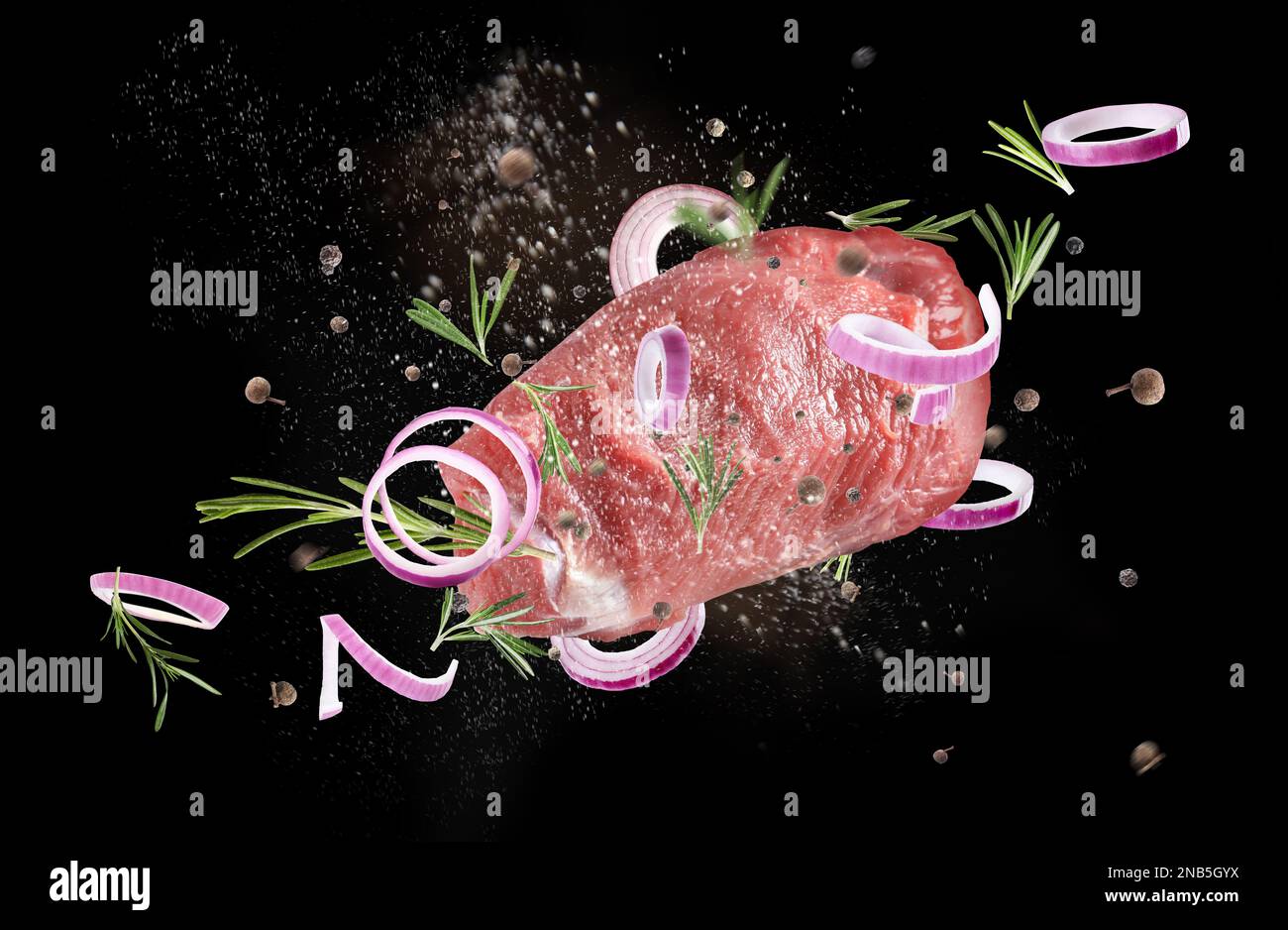 Herbs spices falling on black hi-res stock photography and images - Alamy