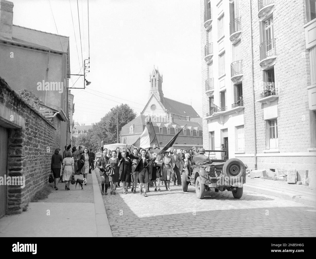 French civilians of Rennes form a parade in a demonstration of joy at ...