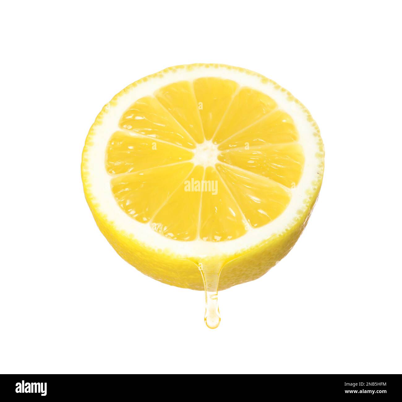 Lemon juice dripping from fruit on white background Stock Photo - Alamy
