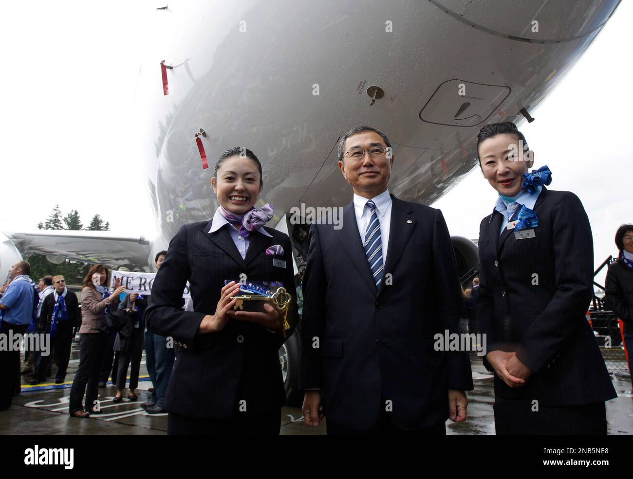 Shinichiro Ito, center, president and CEO of All Nippon Airways, poses ...