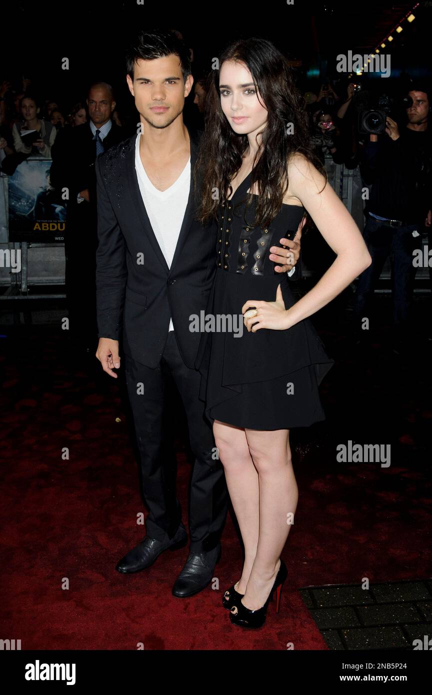 British actress Lily Collins and U.S actor Taylor Lautner rarrive for ...