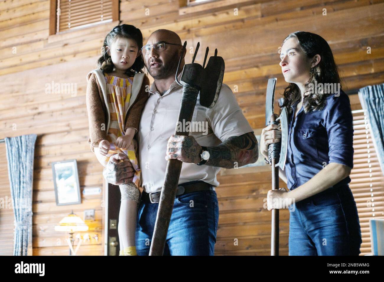 KNOCK AT THE CABIN, from left: Kristen Cui, Dave Bautista, Abby Quinn ...