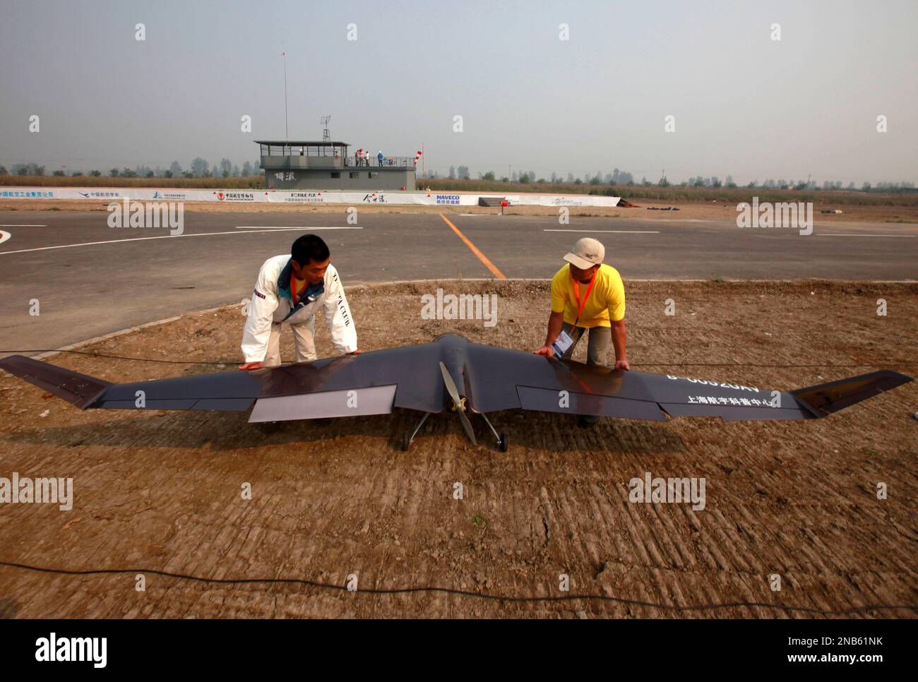 Contestants prepare their remote control model airplane during ...