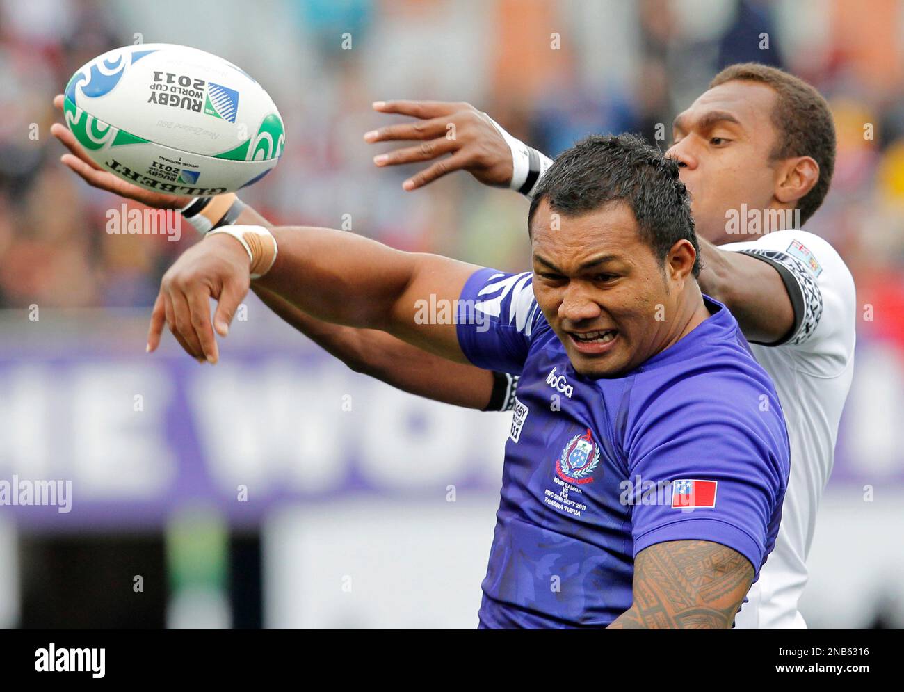 Samoa's George Stowers, left, and Fiji's Leone Nakarawa compete for the ...