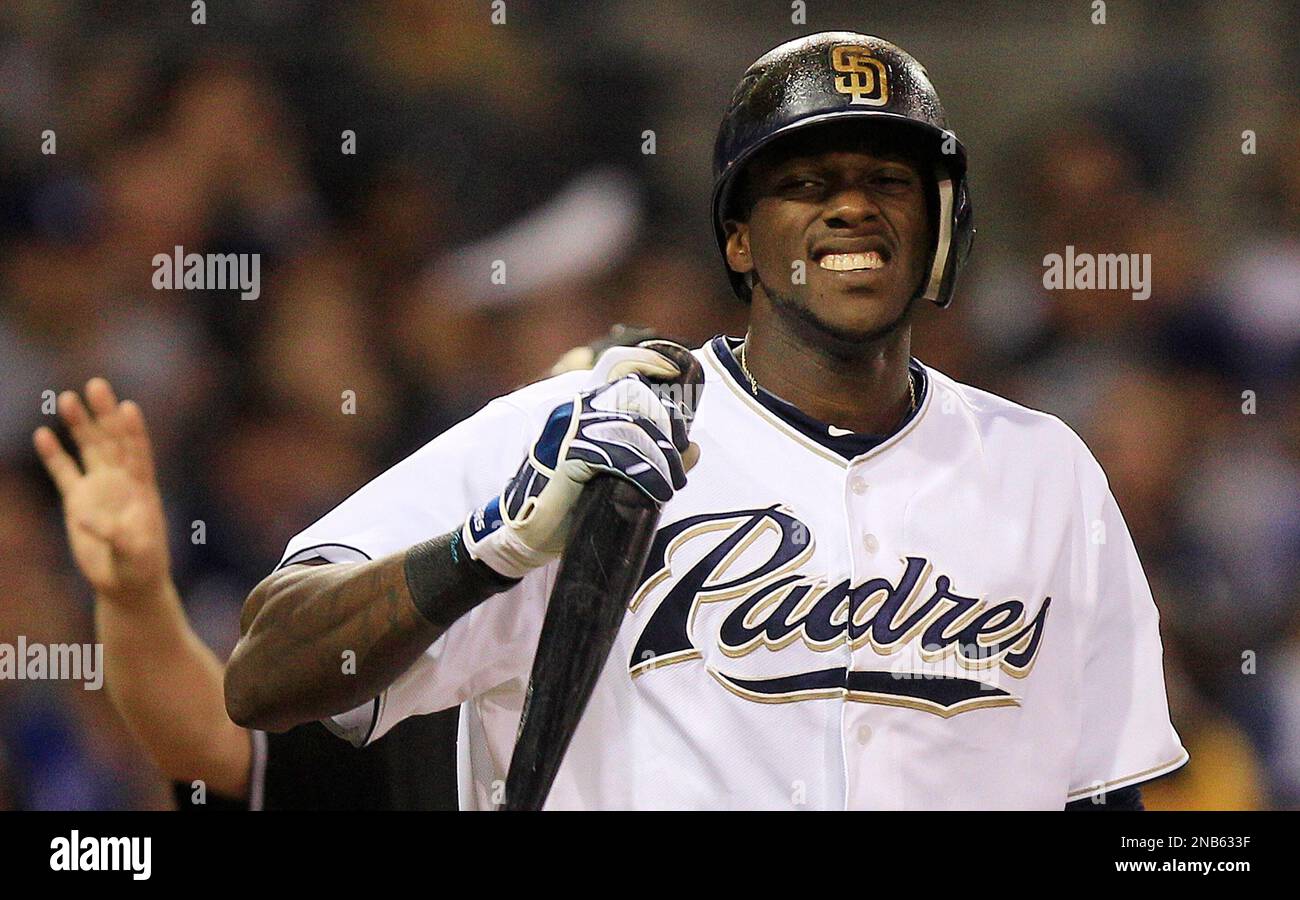 San Diego Padres' Cameron Maybin reacts after being hit in the back by ...