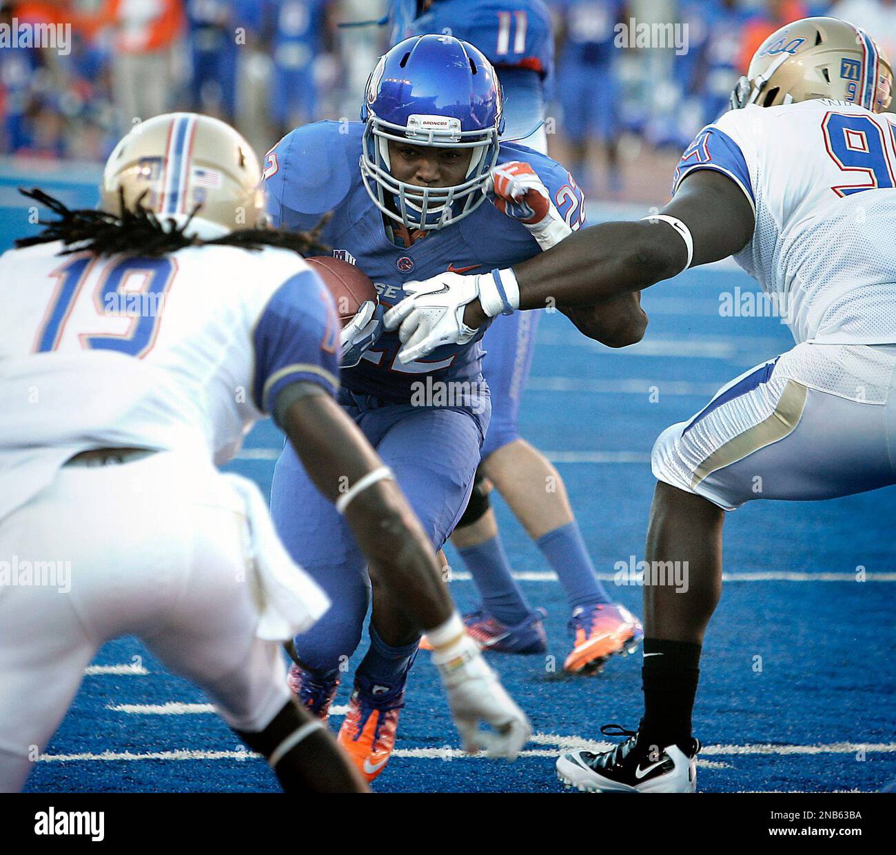 Boise State's Doug Martin (22) rushes against Tulsa's Milton Howell (19 ...