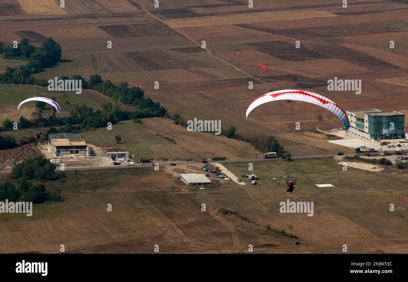Paragliders fly from the mountain of Korisa during first ever national ...