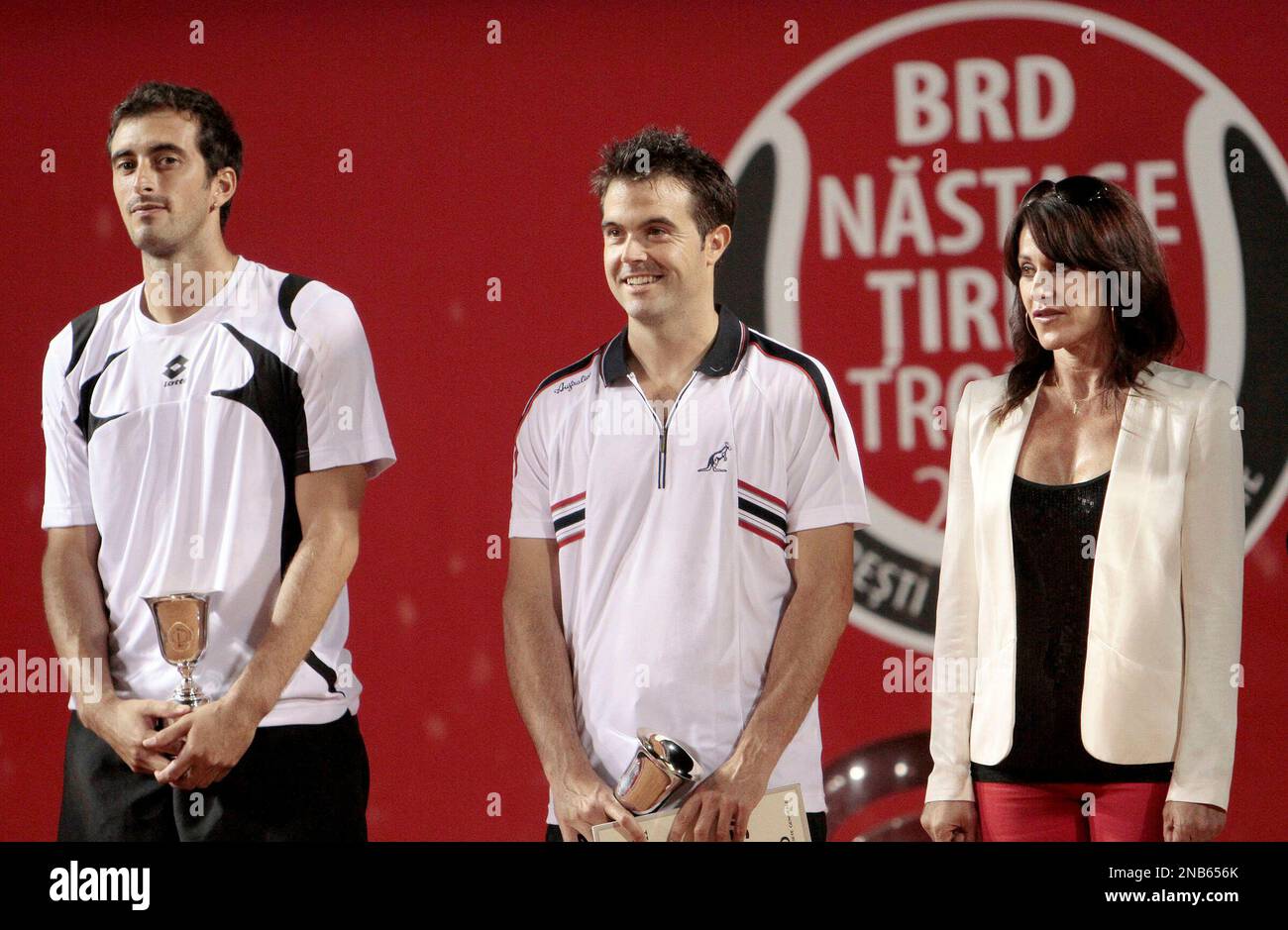 Italy's Daniele Bracciali, center, and Potito Starace, left, stand ...