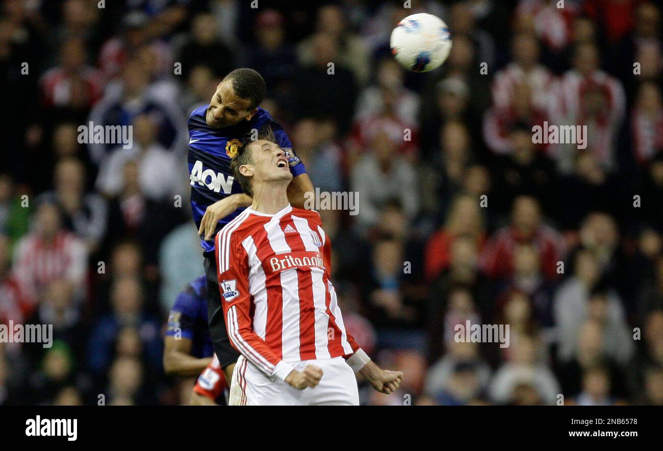 Stoke City's Peter Crouch, bottom, jumps for the ball against ...