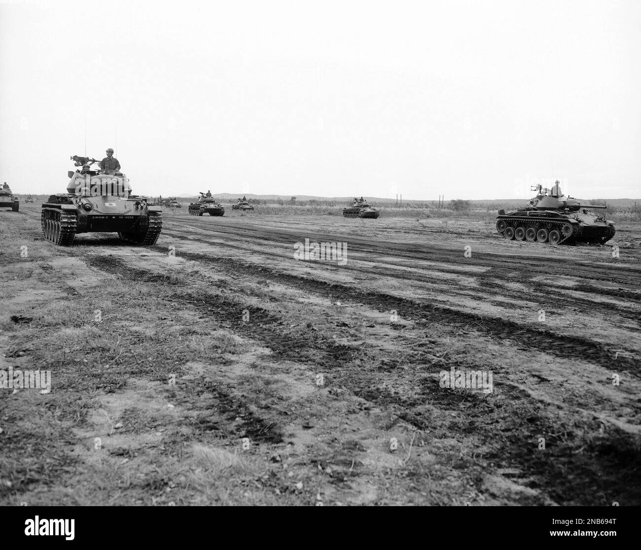American-made Japanese tanks rumble down the airfield towards the ...