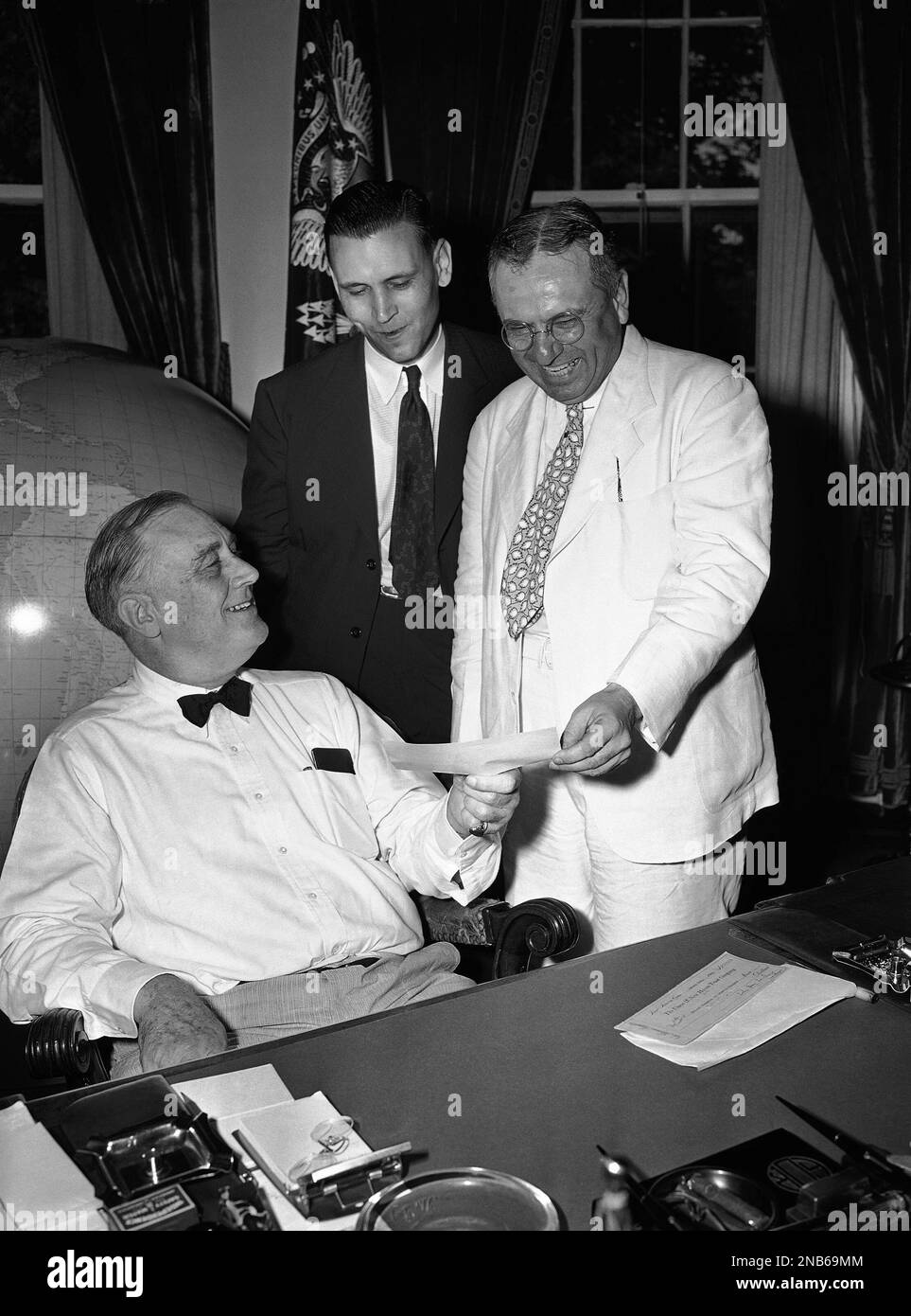 President Franklin D. Roosevelt, pausing on a busy day at the White ...