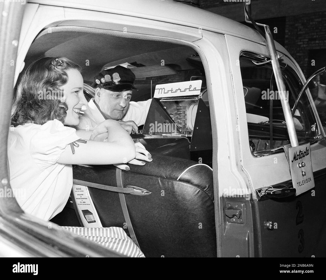Taxi driver Charles De Lorne demonstrates his newly installed Motorola ...