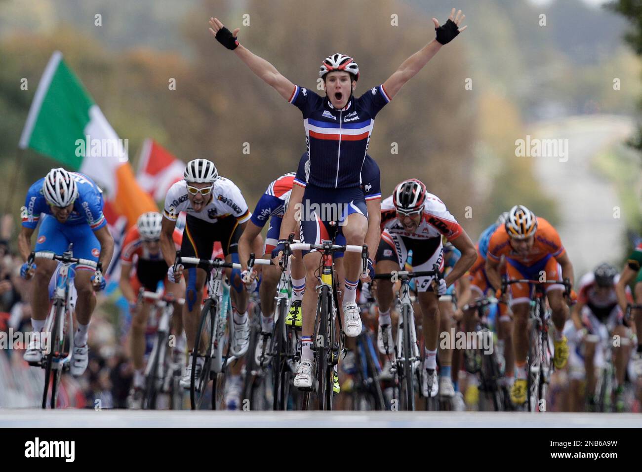 New world champion Arnaud Demare of France celebrates winning the men ...