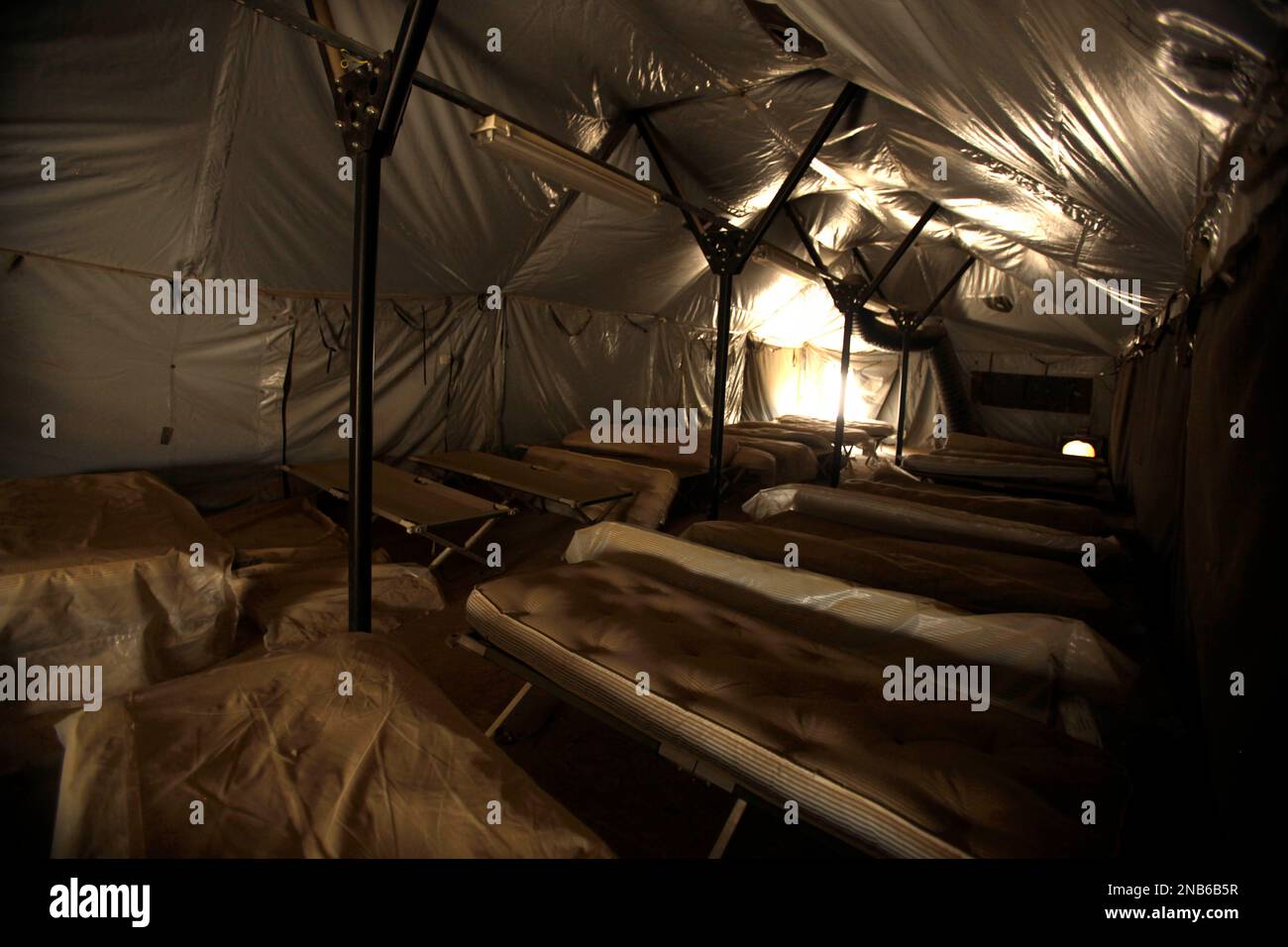 In this Thursday, Aug. 4, 2011 photo, dust-covered mattresses and cots ...