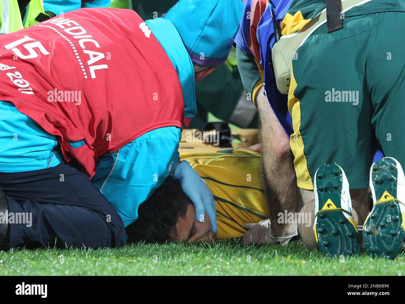 Australia's Anthony Faingaa is attended to by medics after he was ...