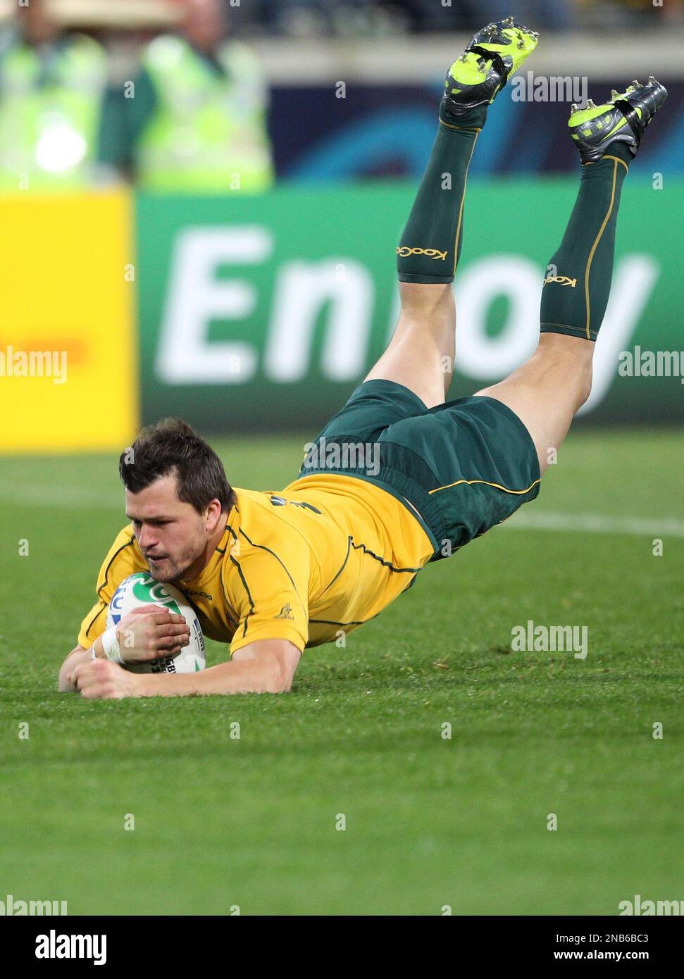Australia's Adam Ashley-Cooper is airborne as he scores a try during ...