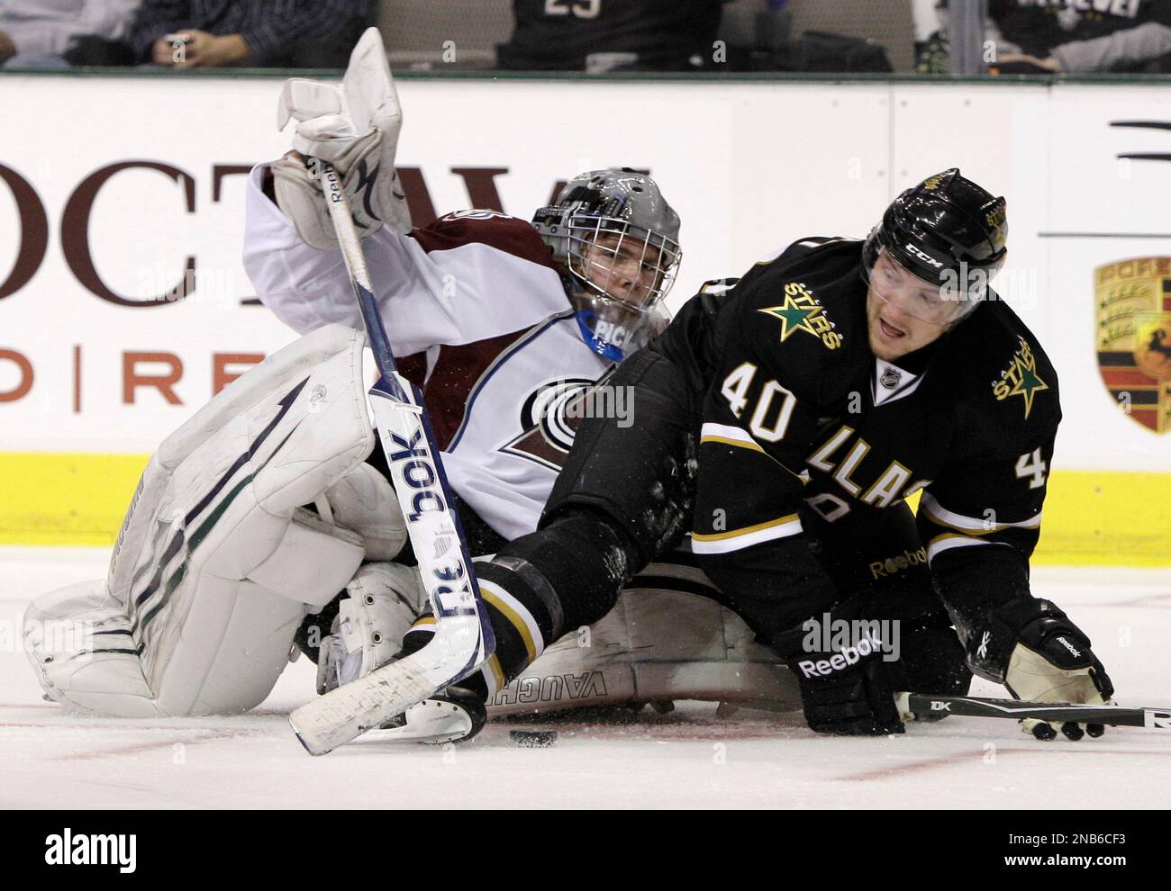 Colorado Avalanche goalie Calvin Pickard, left, stops a drive to the ...
