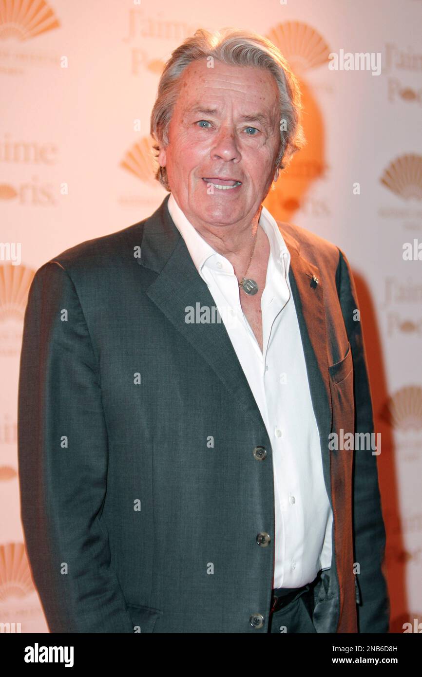 French actor Alain Delon poses as he arrives at the opening party of ...