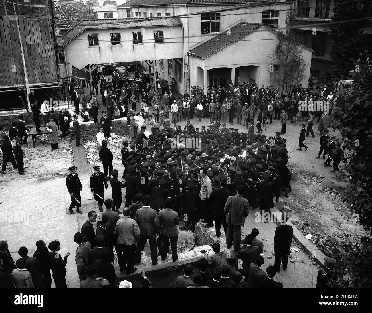 Police arrive 800 strong, and broke up the meeting with clubs in Tokyo on May 31, 1949. During ...