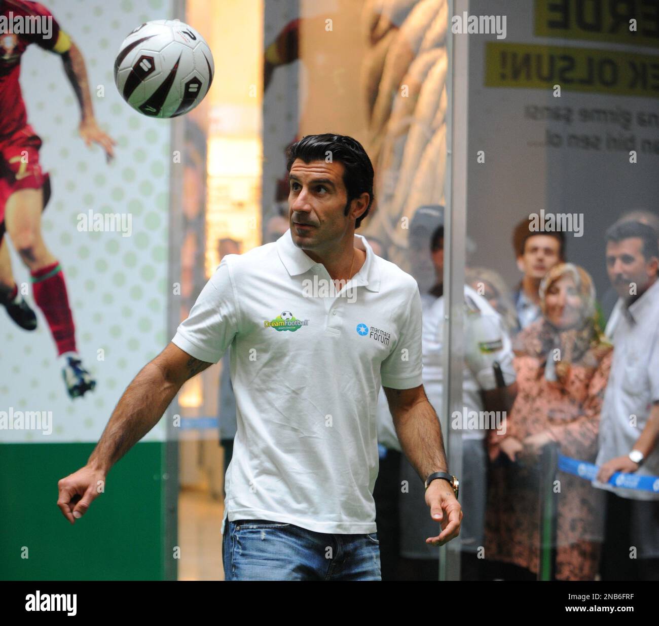 Retired Portugese soccer star Luis Figo plays with a ball in Istanbul ...