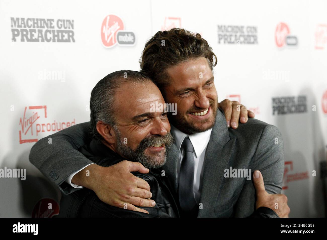 Cast member Gerard Butler, right, and Sam Childers, whose life is the ...