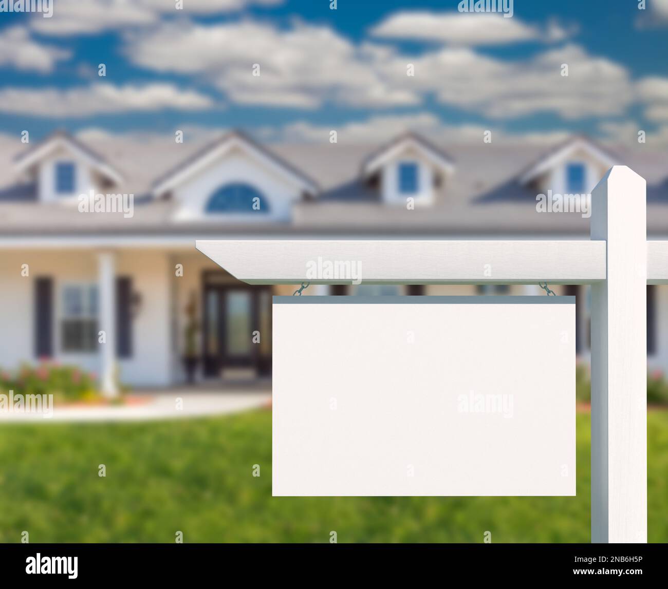 Blank Real Estate Sign in Front of New House Stock Photo - Alamy