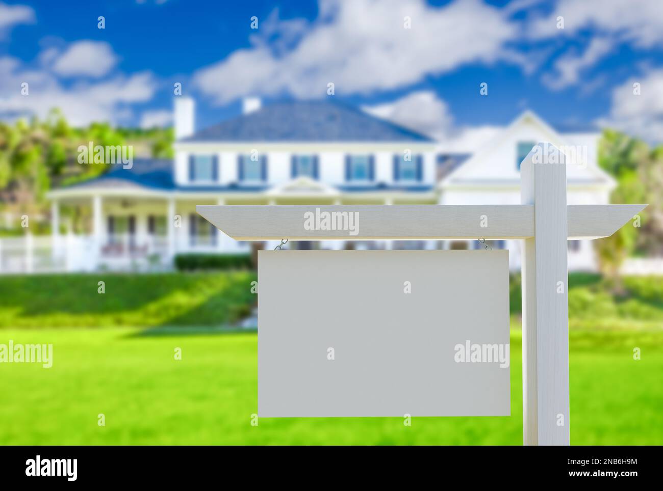 Blank Real Estate Sign in Front of New House Stock Photo - Alamy