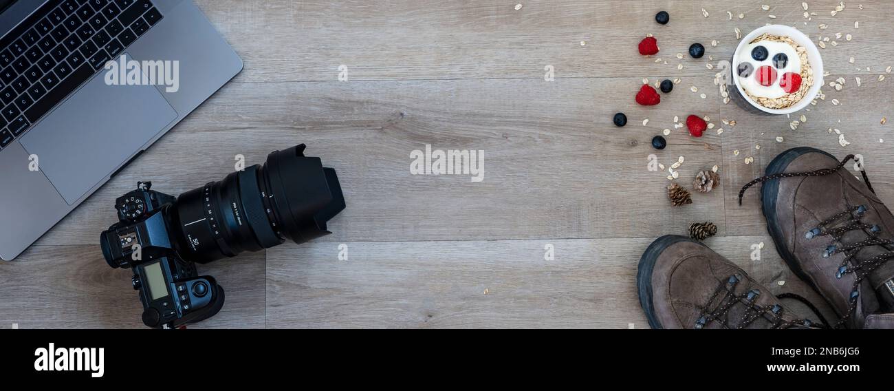 Panorama recording with laptop, digital camera, hiking boots, muesli ...