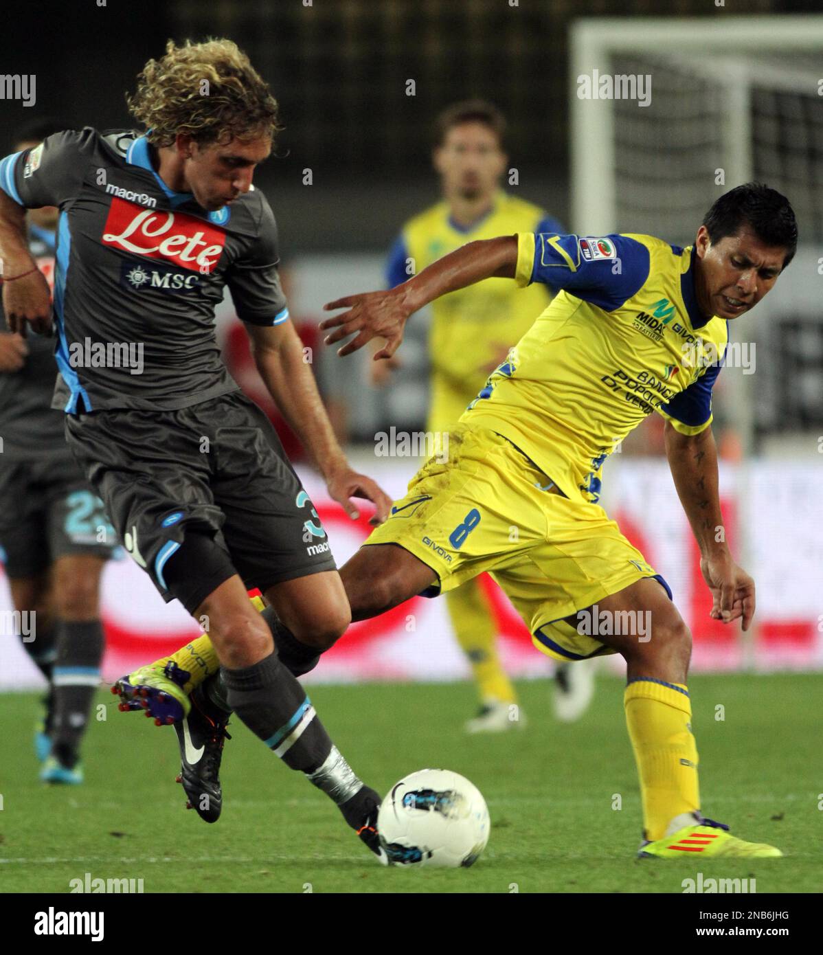 Chievo's Rinaldo Cruzado right, of Peru' and Napoli's Ignacio Fideleff ...