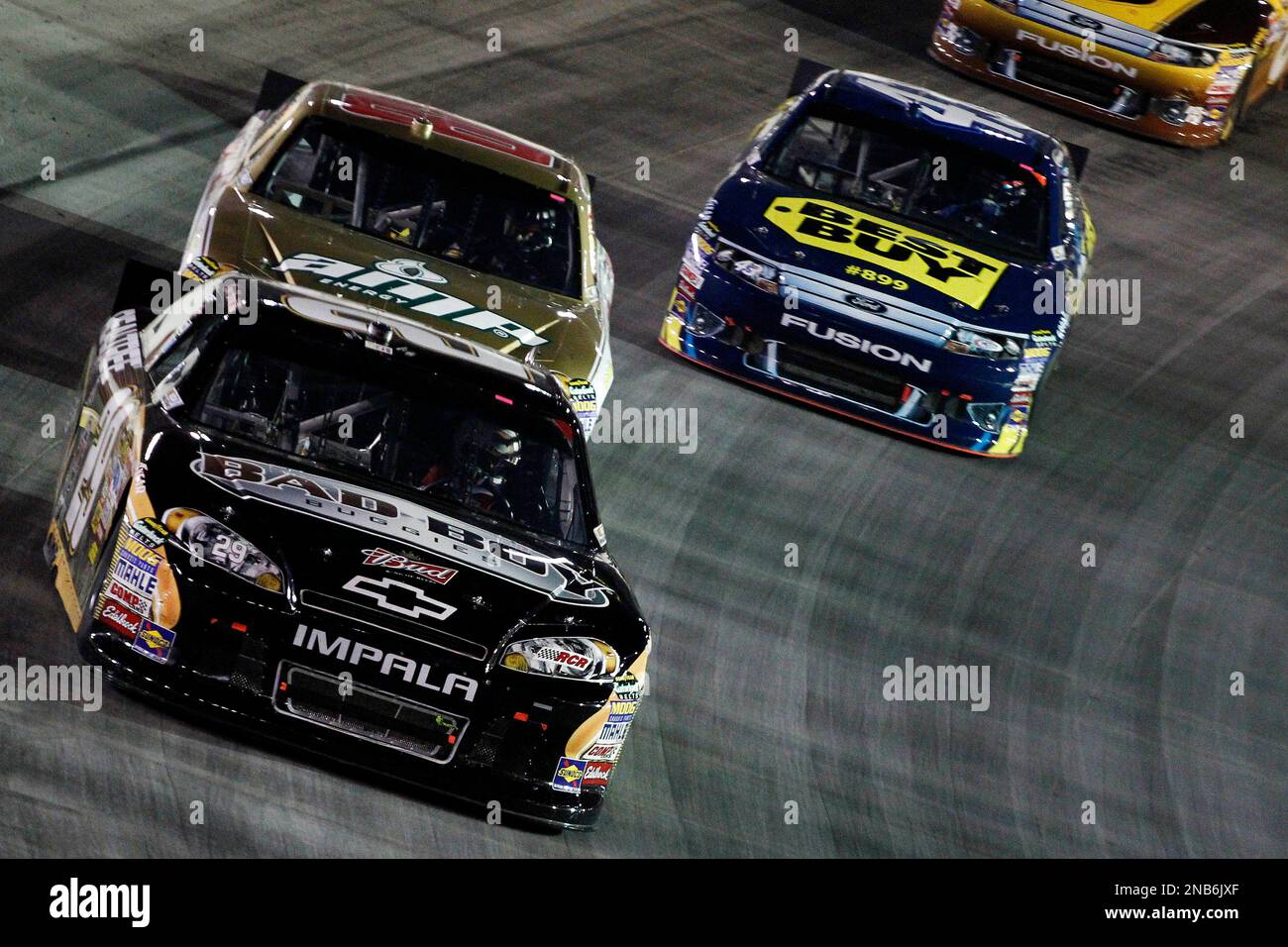 Kevin Harvick (29) leads Dale Earnhardt Jr. (88) and A. J. Allmendinger ...