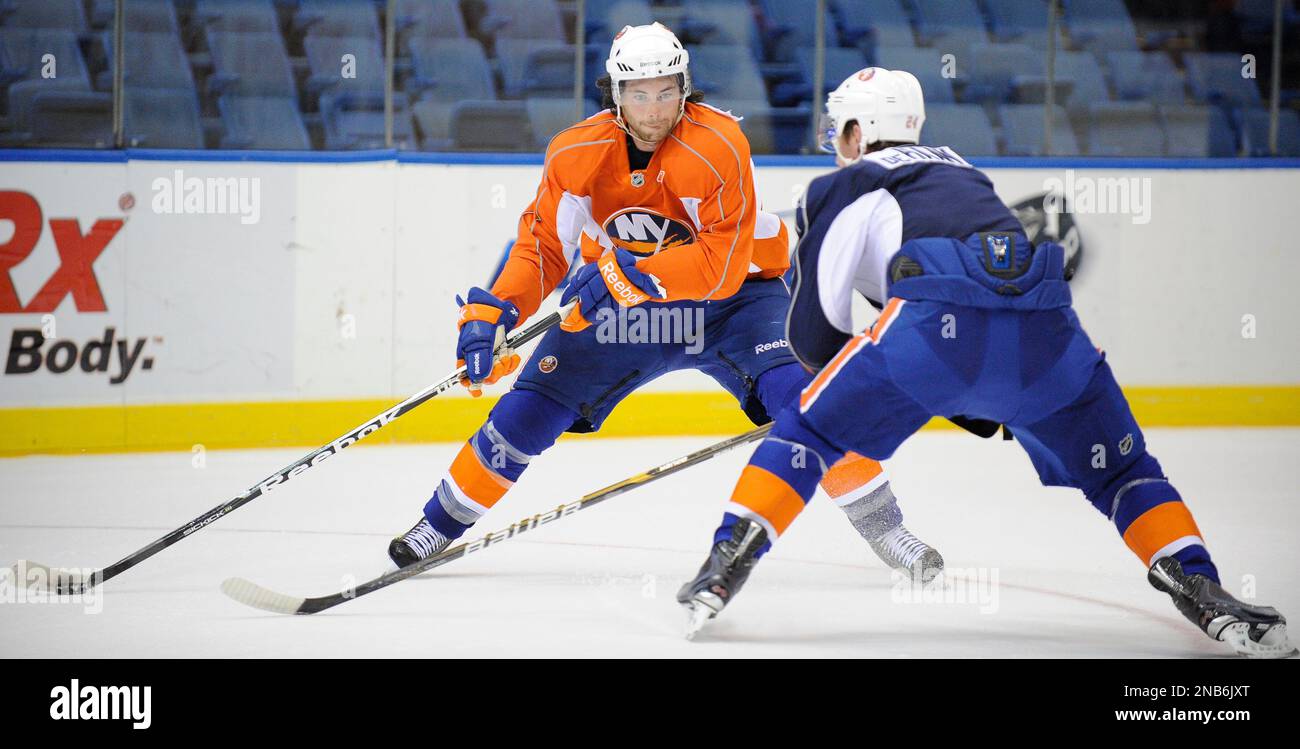 New York Islanders center Jeremy Colliton, left, and defender Calvin de ...