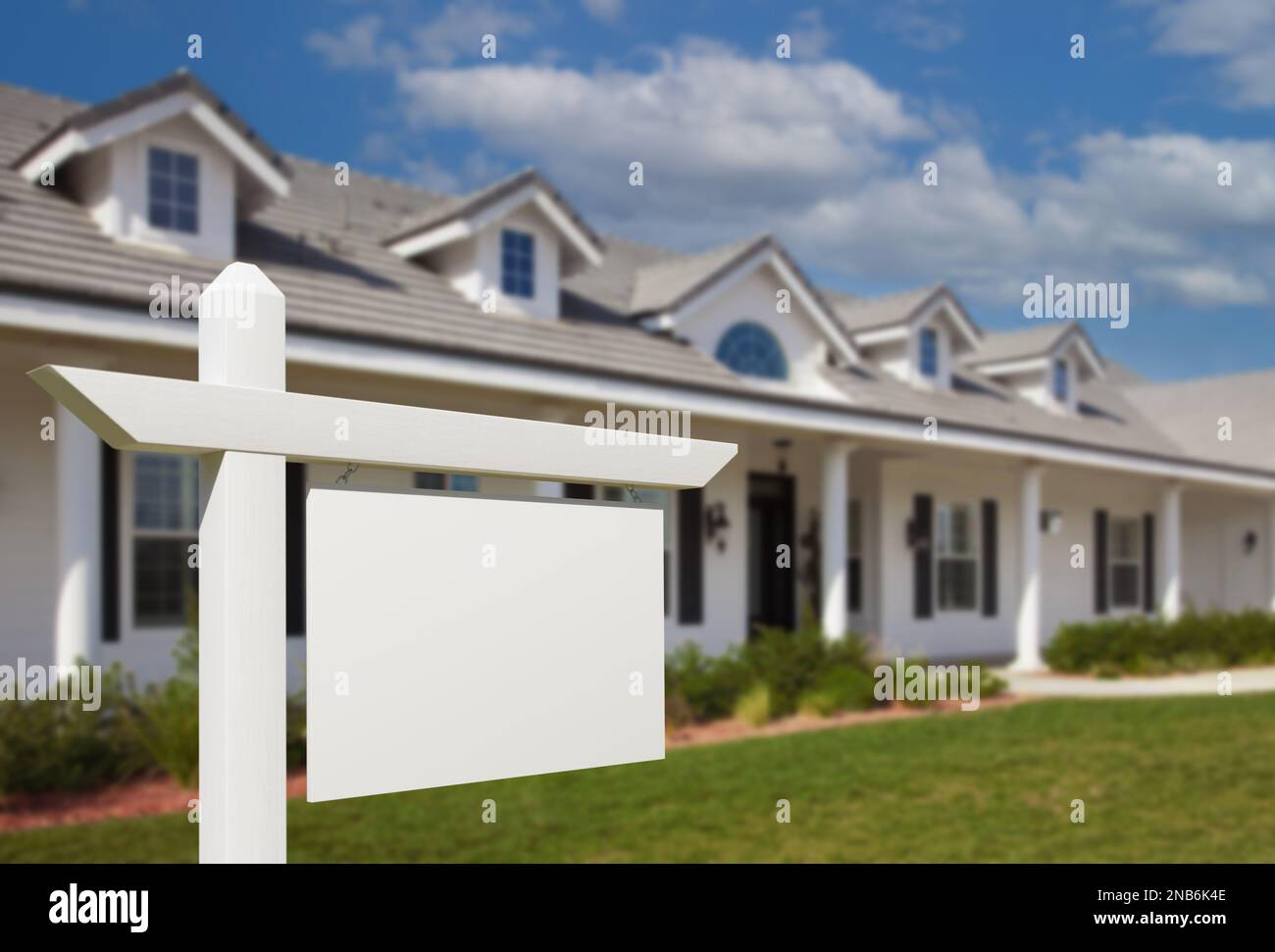 Blank Real Estate Sign in Front of New House Stock Photo - Alamy
