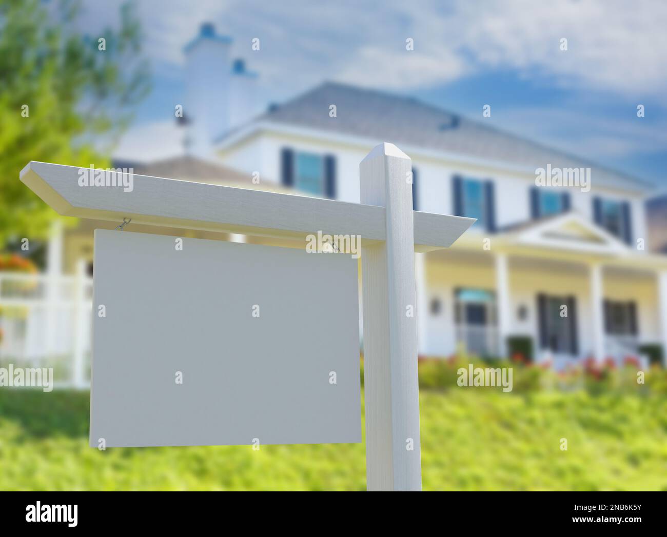 Blank Real Estate Sign in Front of New House Stock Photo - Alamy