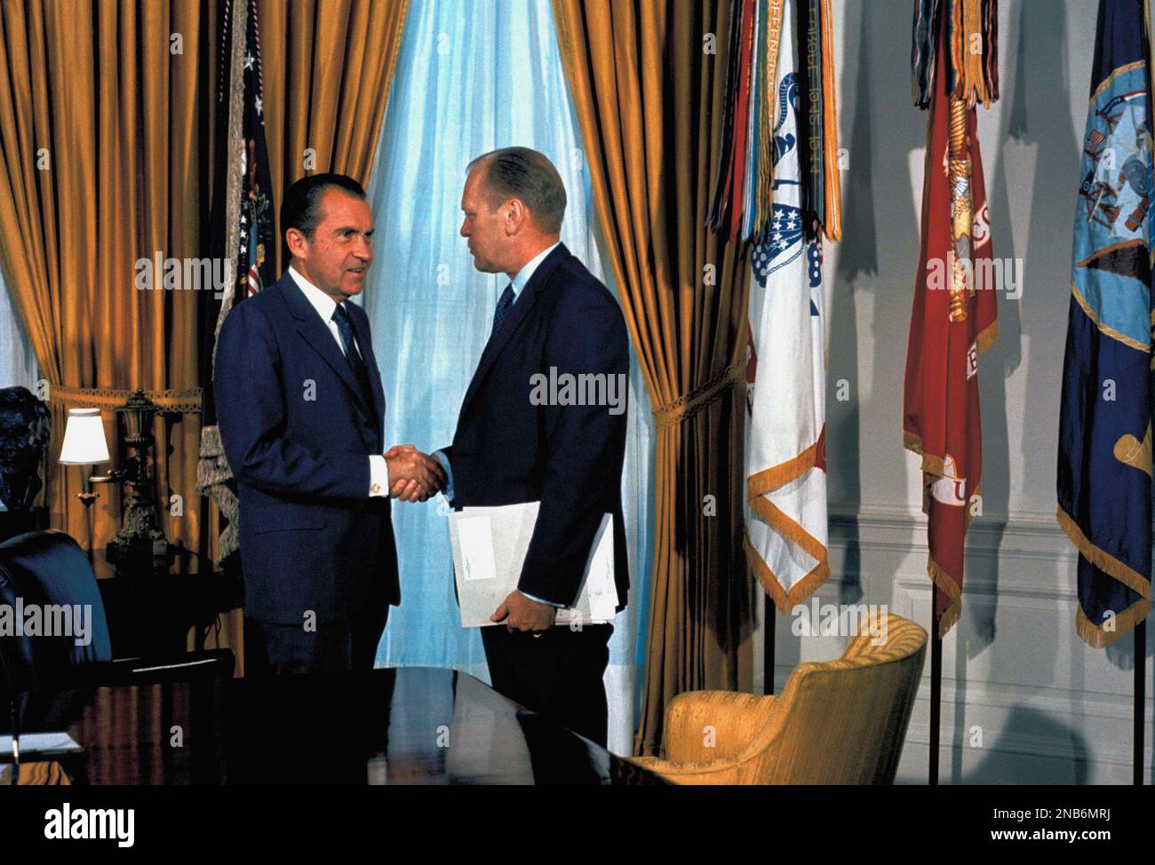 Vice President Gerald Ford shakes hands with President Richard Nixon in ...