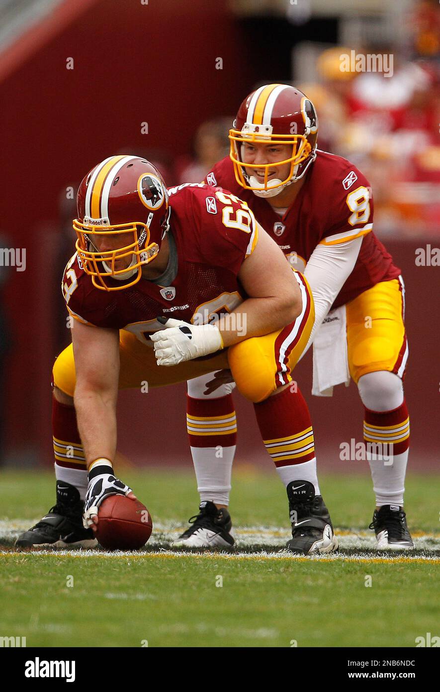 Washington Redskins quarterback Rex Grossman (8) lines up behind center ...