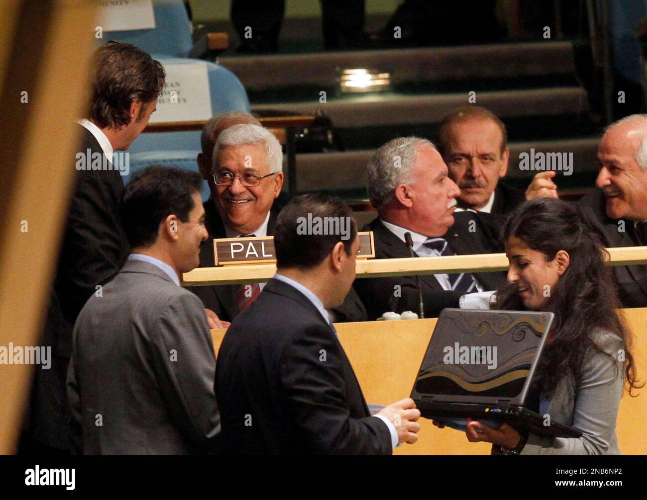 Palestinian President Mahmoud Abbas, left, converses during the 66th ...