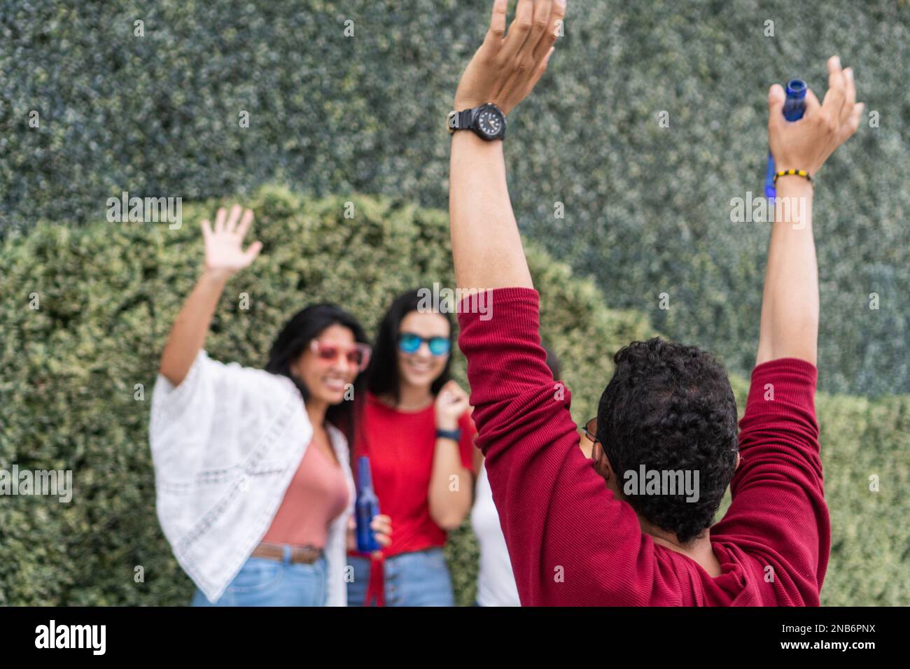 Friends greeting each other hi-res stock photography and images - Alamy