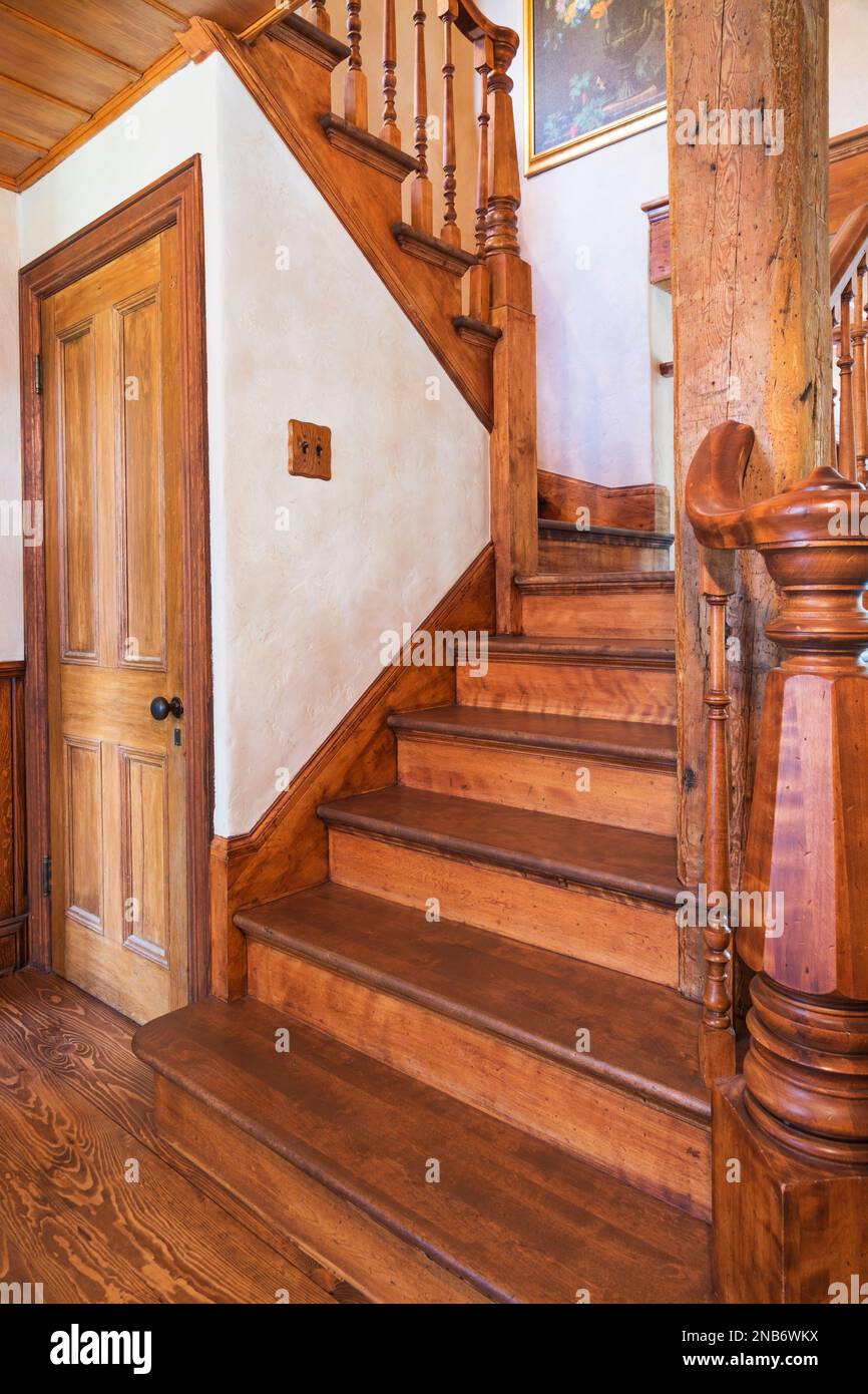 Cherry wood staircase leading to upstairs floor inside old 1826 cottage ...