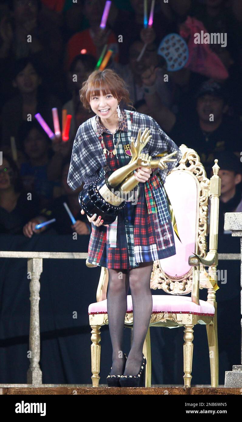 Mariko Shinoda, a members of Japan's popular girl group AKB48, holds a ...