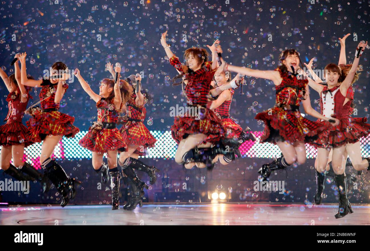 Members of Japan's most popular girl group AKB48 perform during a ...