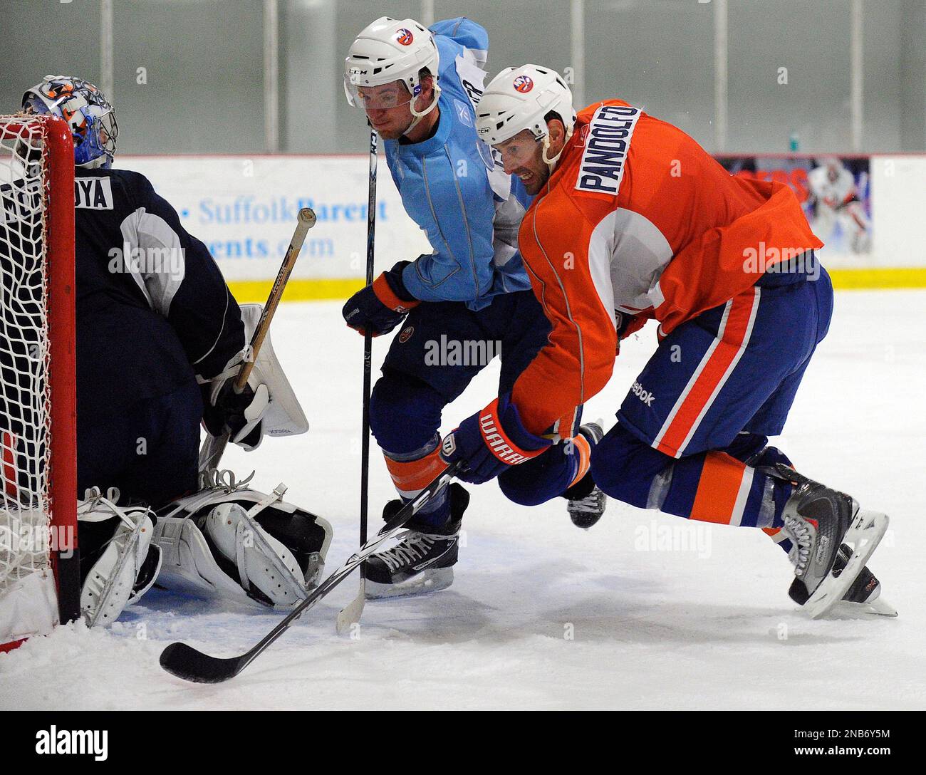 New York Islanders Jay Pandolfo, right, on the ice at training camp in ...