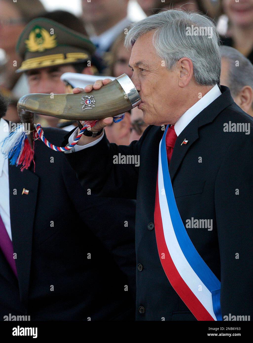 Chile's President Sebastian Pinera uses a ritual horn to drink Chicha ...