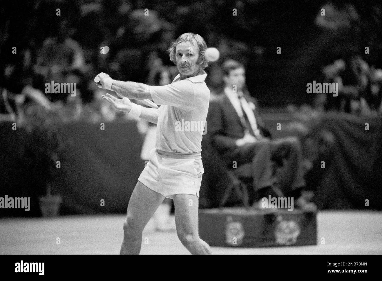 Rod Laver of Australia keeps his eyes on ball as he cocks his arm for a ...