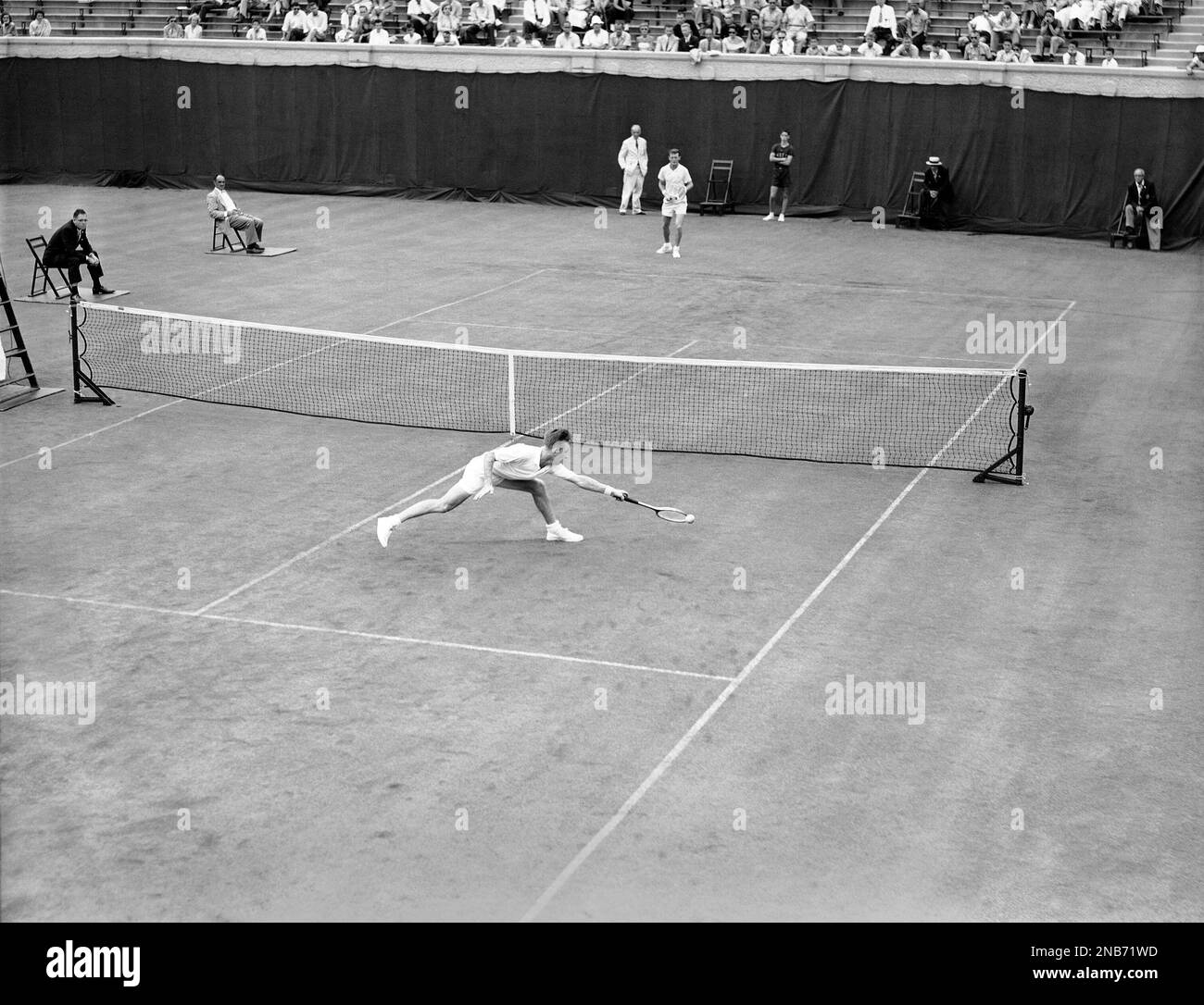 Rodney Laver of Australia, foreground, stretches to the limit but he ...