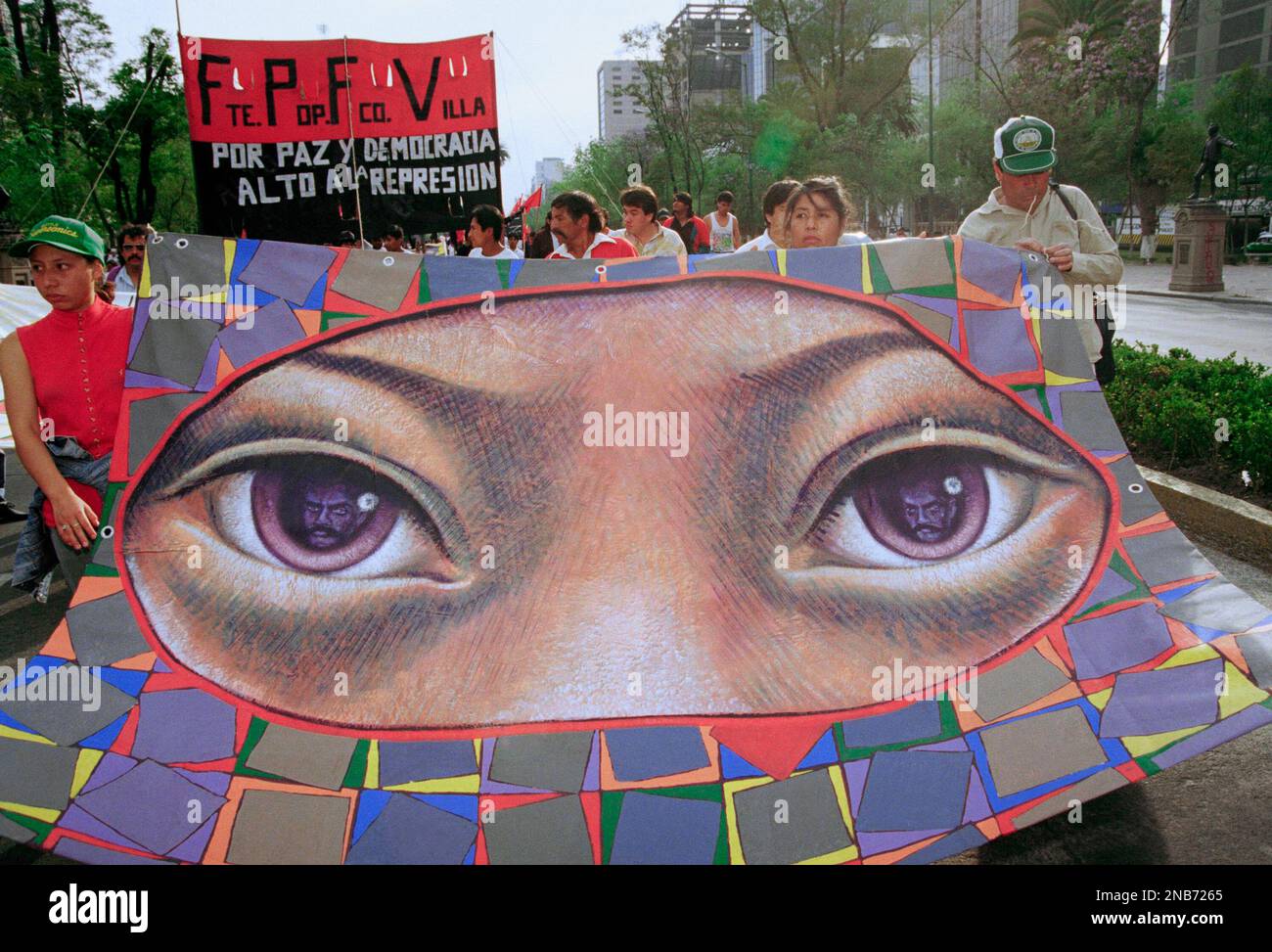 Thousands of marchers parade down a street in Mexico City, April 10 ...