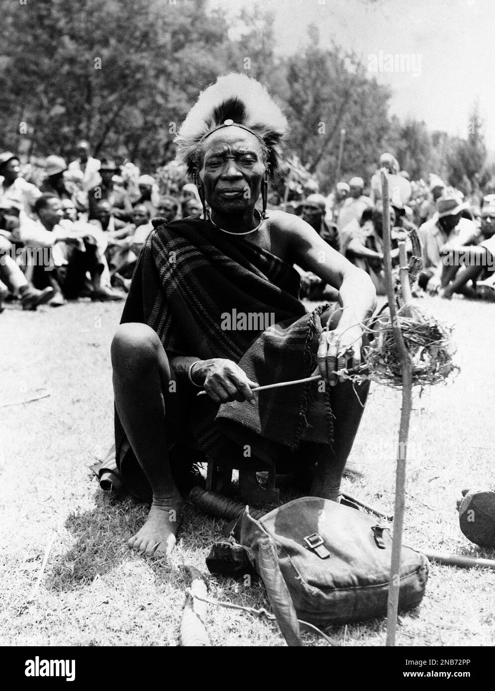 The Mundo Mugo preparing his paraphernalia before administering a ...