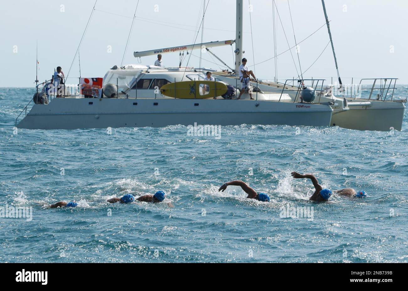 Japanese athletes swim the final stretch into the Suao harbor ...